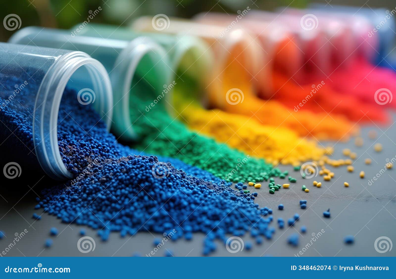 Colorful Biodegradable Plastic Granules Spill from Containers on Dark ...