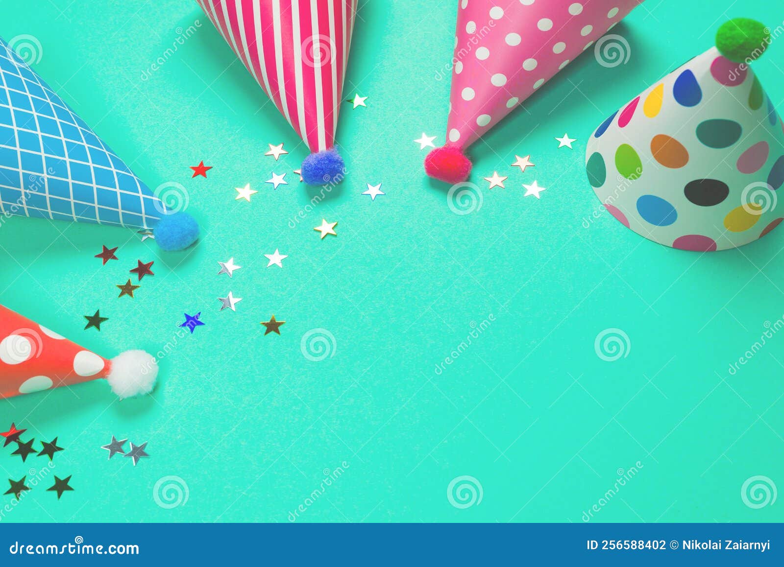 Colorful Birthday Caps on a Blue Background. Top View Stock Photo ...