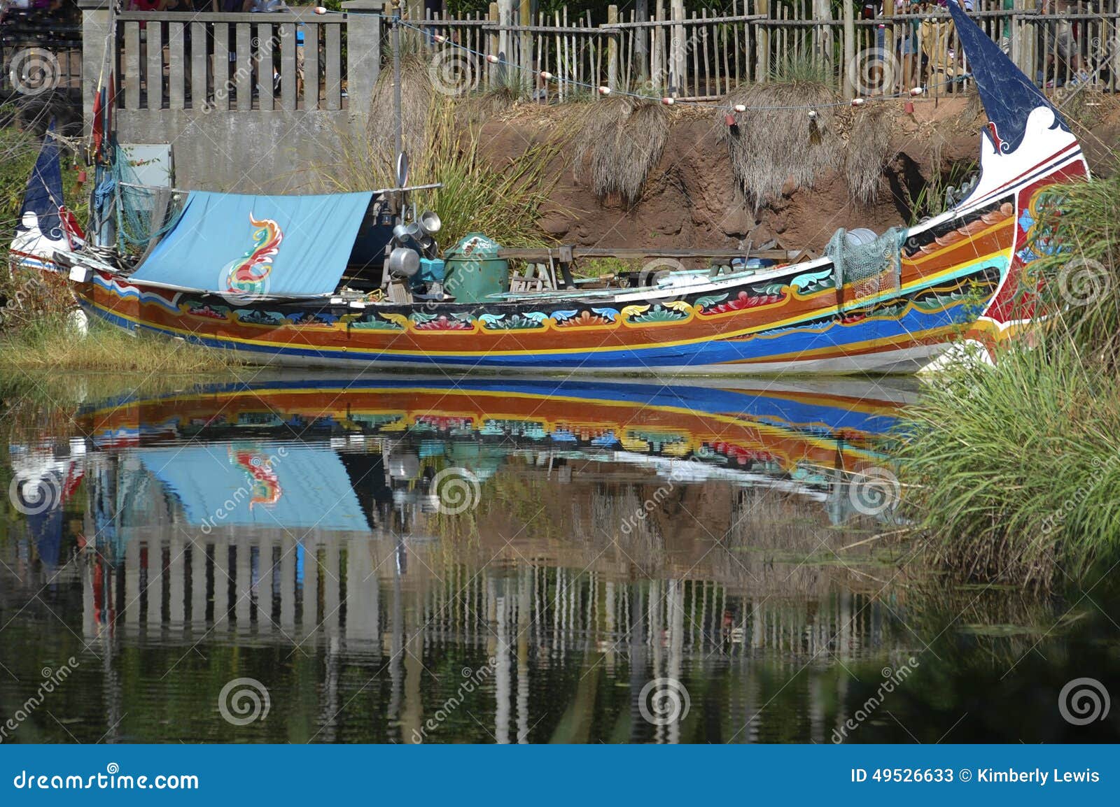 Colorful Boat Complete with Supplies in a Pond with Reflections. Stock ...