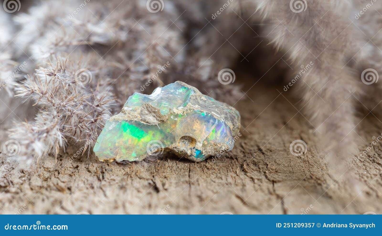 Colorful Boulder Opal Stone on Wooden Background Stock Image - Image of ...