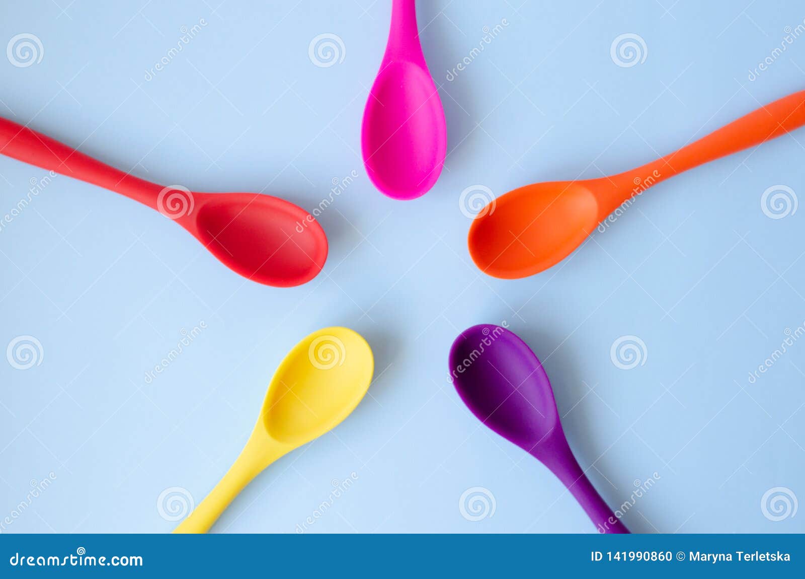 Multi-colored Spoons on a Blue Background Stock Photo - Image of ...