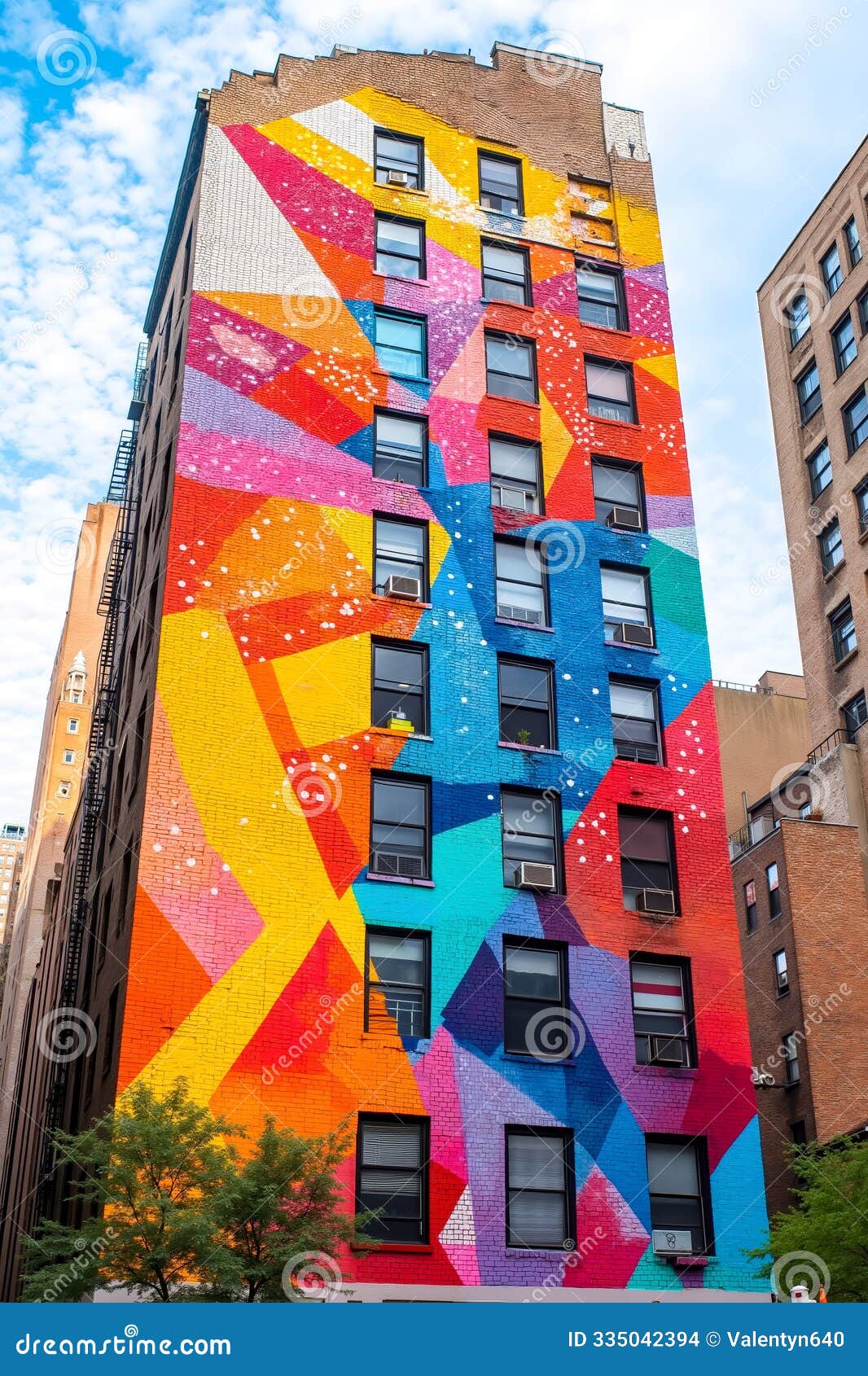 A Colorful Building with a Colorful Mural on the Side of it Stock Photo ...