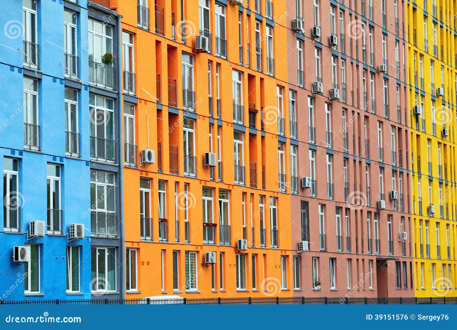 Colorful Buildings Reflect In The Canal On The Island Of Burano In ...