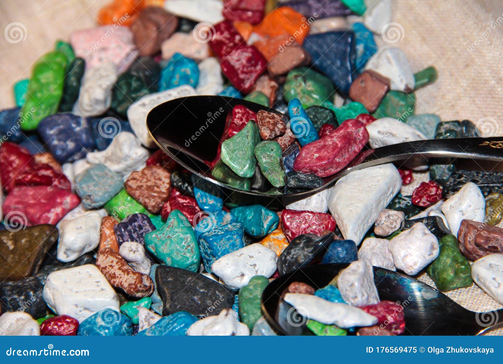 Colorful Candies on a Spoon. Chocolate in the Form of Stones Stock ...