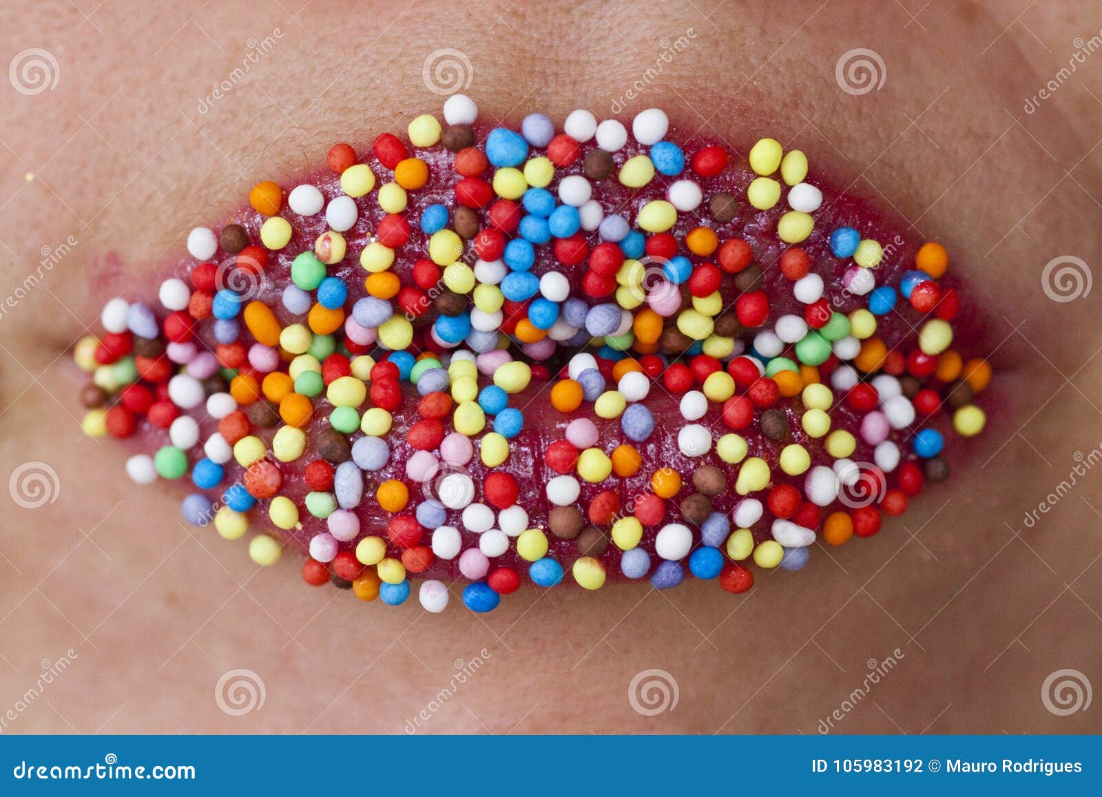 Colorful candy on red lips stock photo. Image of tasteful - 105983192