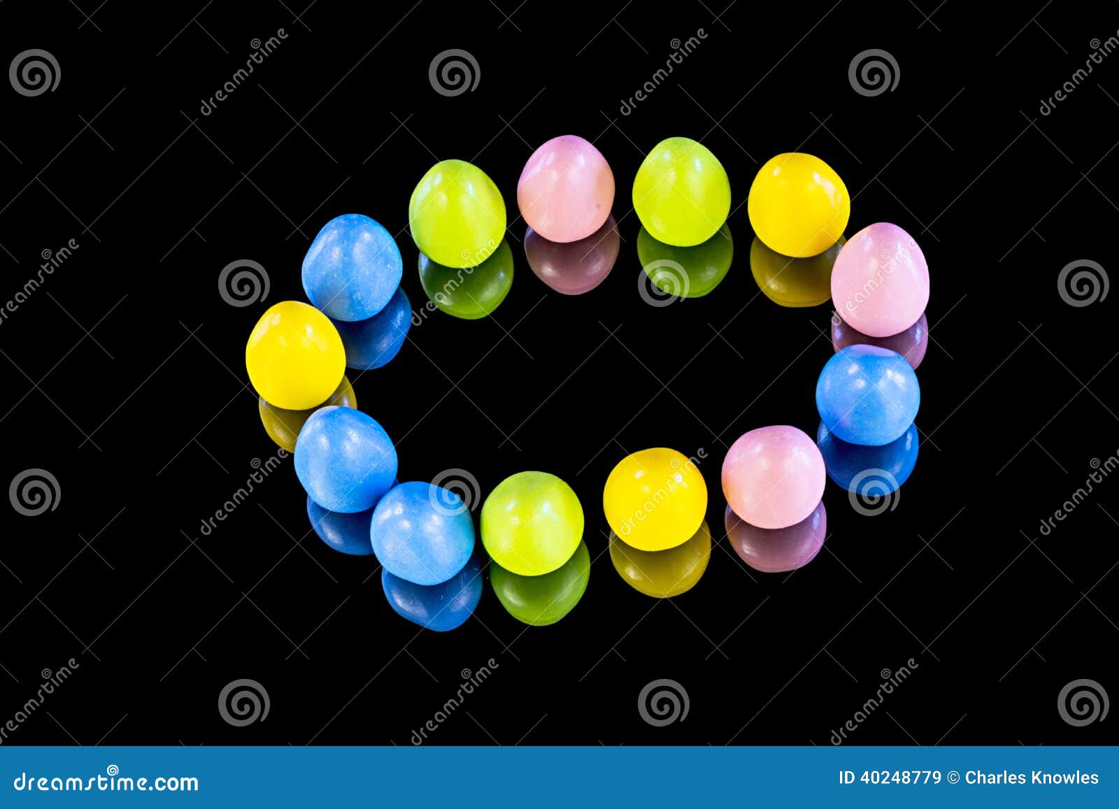 Colorful Candy on a Reflective Surface Stock Image - Image of pink ...