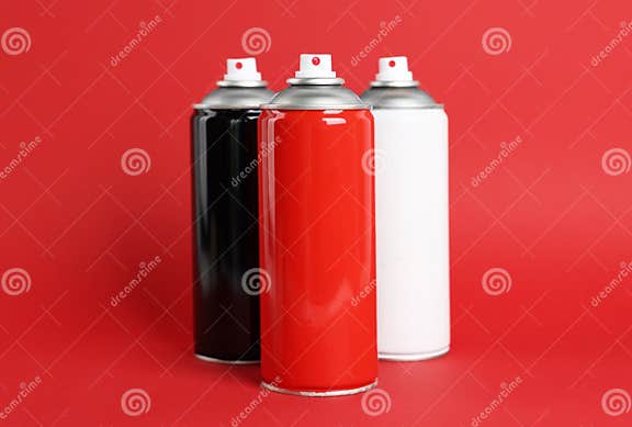 Colorful Cans of Spray Paints on Red Background Stock Image - Image of ...