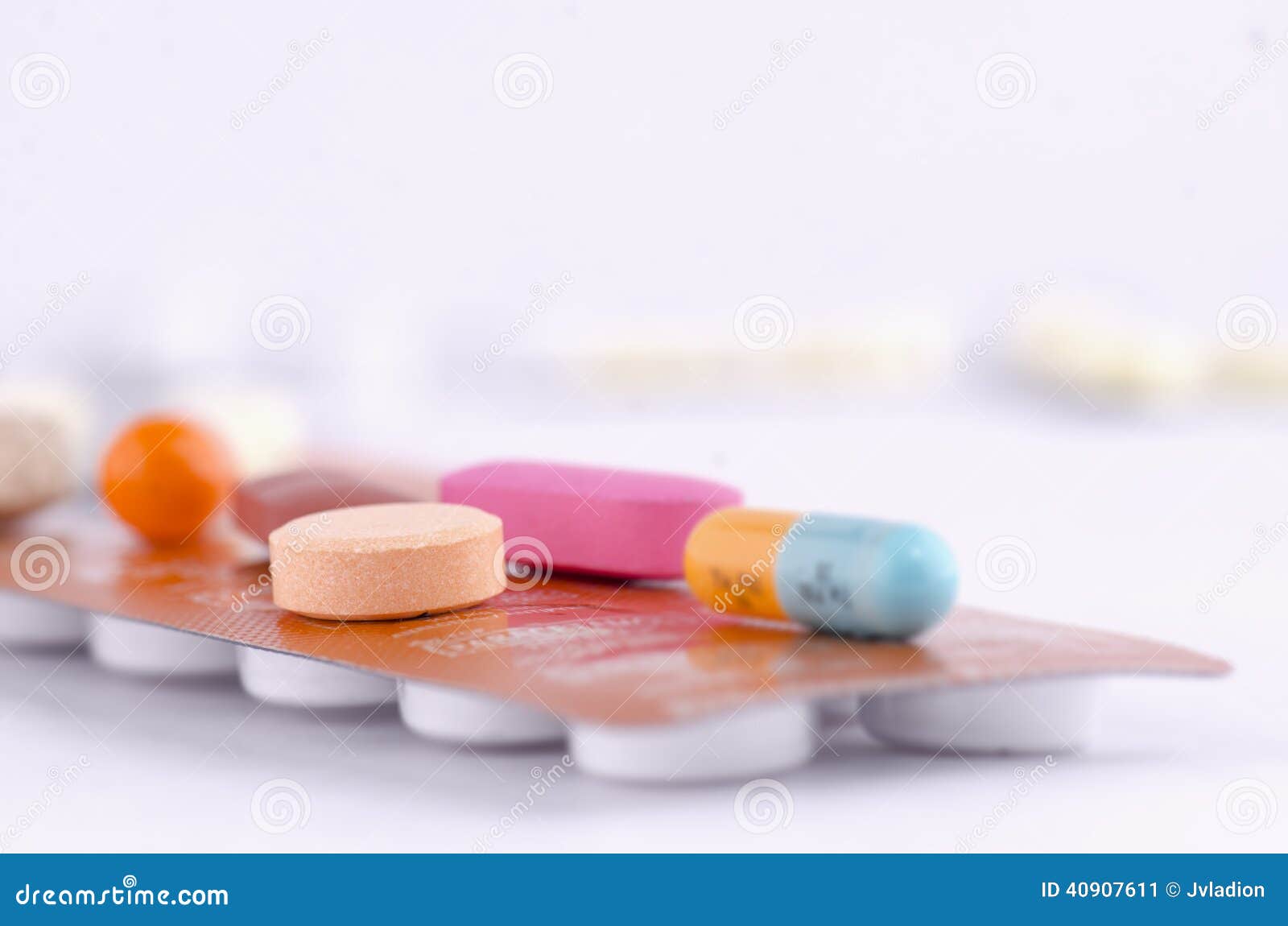 Colorful Capsules and Tablets on Top a Packed Medication. Stock Image ...
