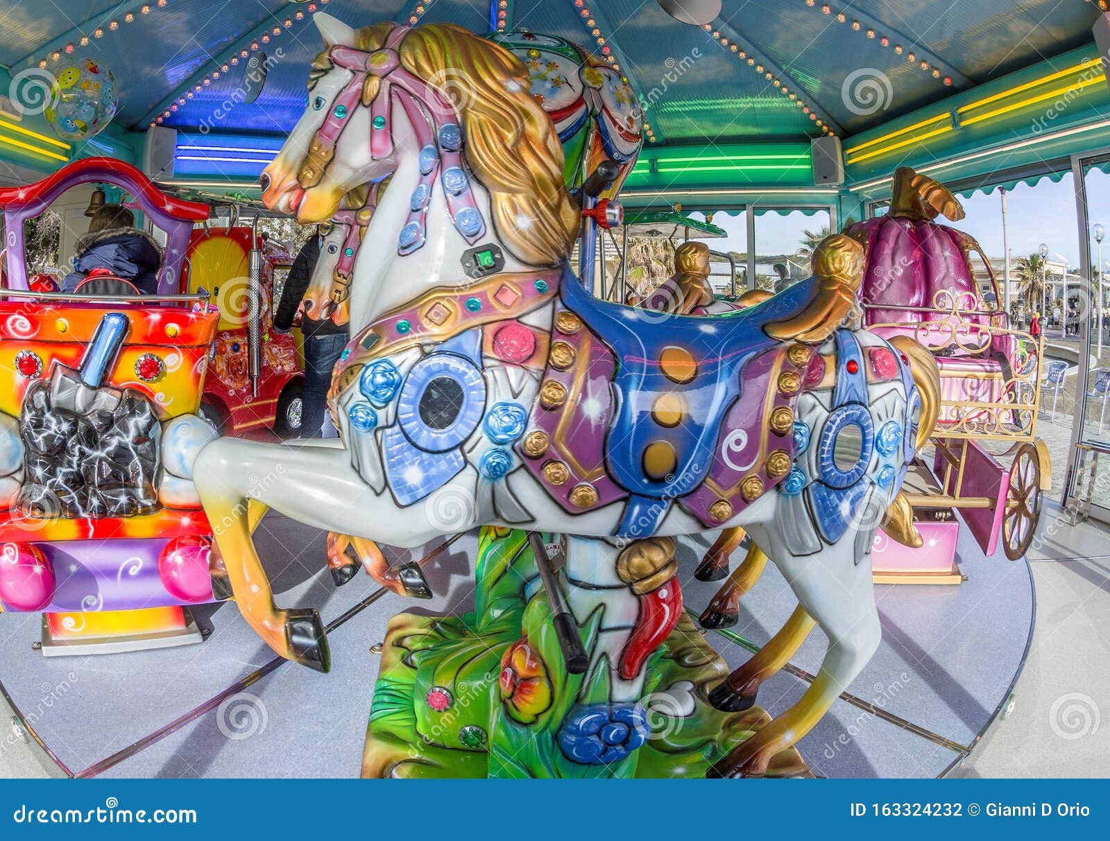 Colorful Carousel at the Amusement Park Stock Photo - Image of ...