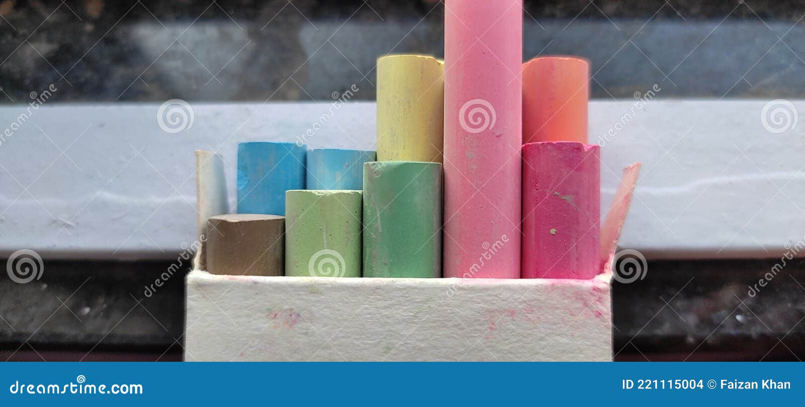 Colorful chalks in a box stock photo. Image of yellow - 221115004