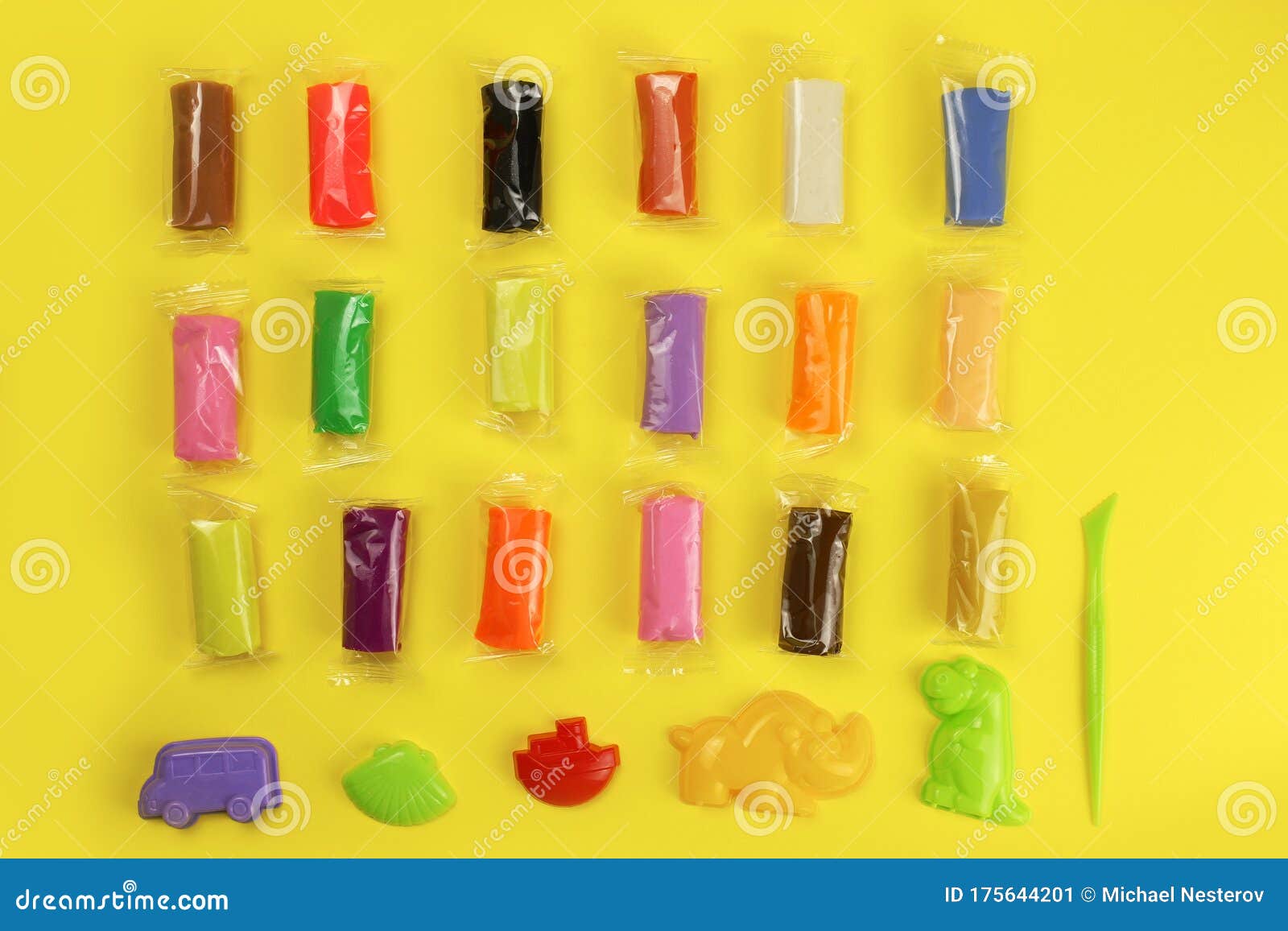 Colorful Clay, Plasticine with Tools on a Yellow Background Stock Image ...