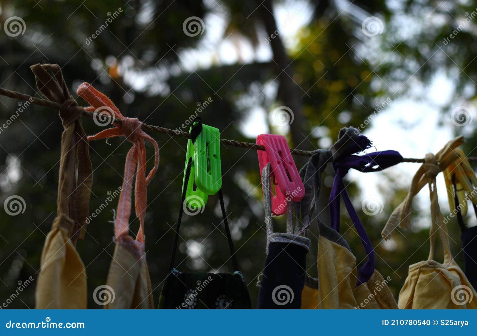 Colorful Clips and Tags in Clothesline Stock Photo - Image of ...