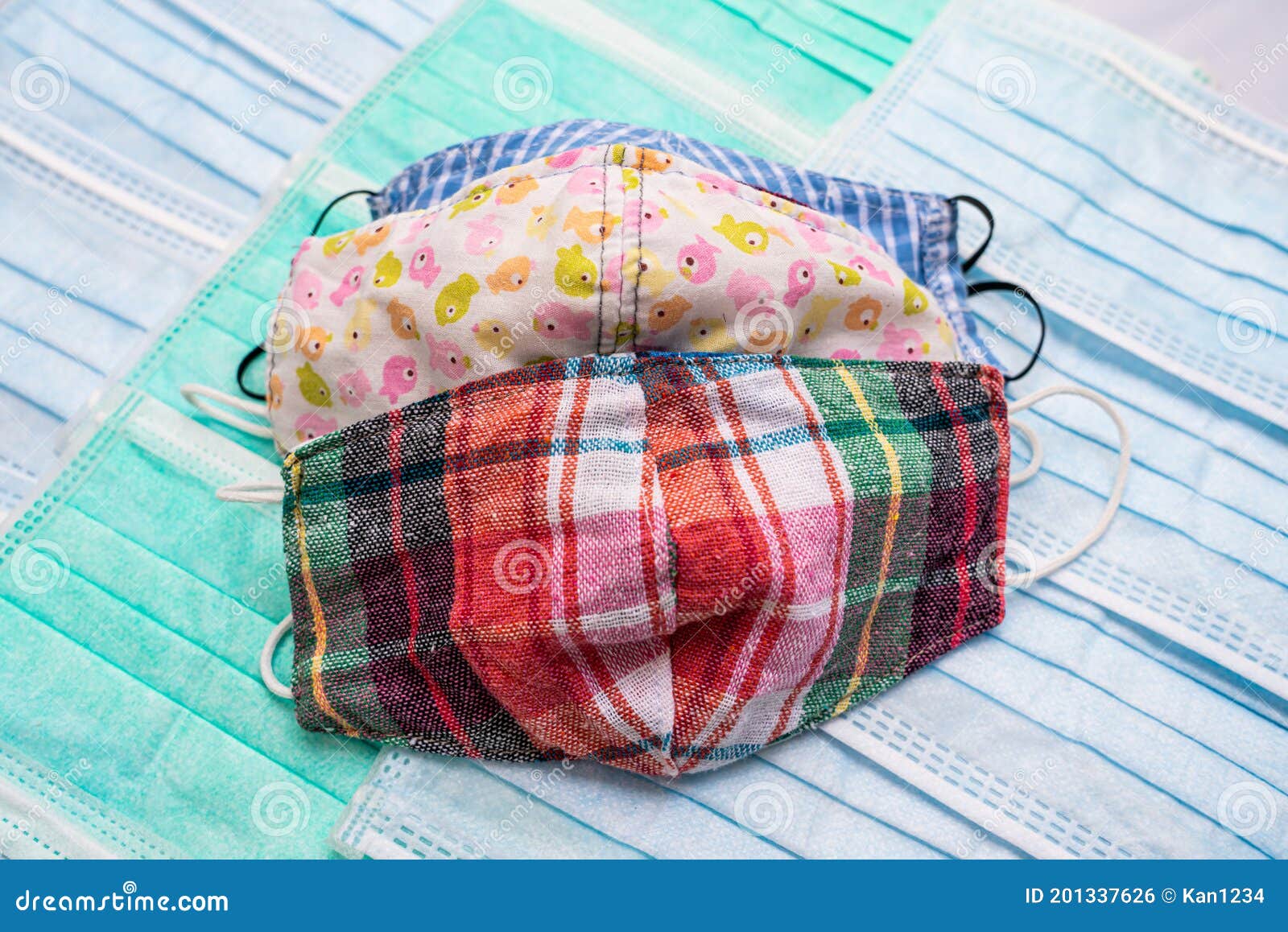 Colorful Cloth Face Masks on Surgical Mask Pattern Background Stock ...