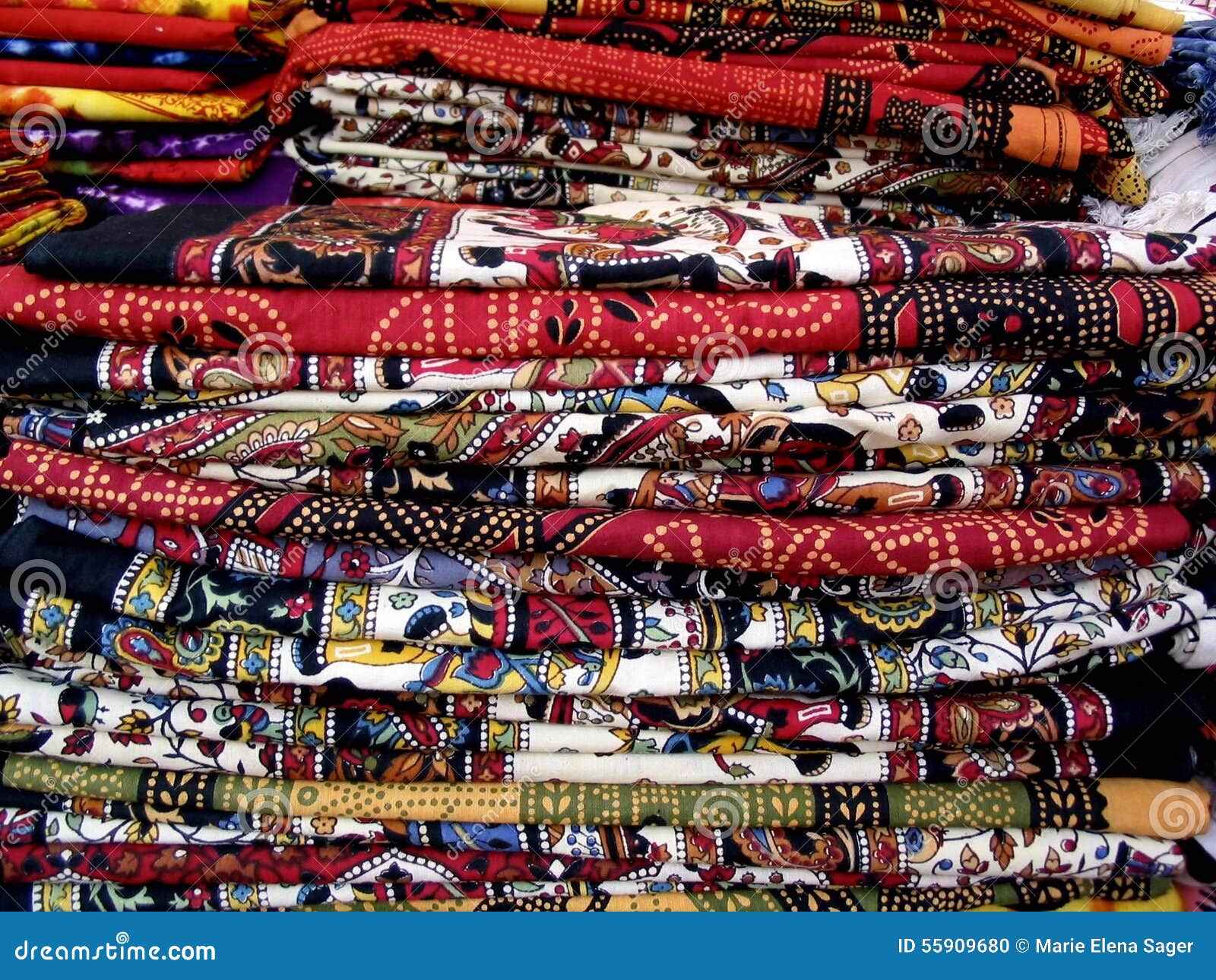 Colorful cloth in piles stock photo. Image of ornate - 55909680