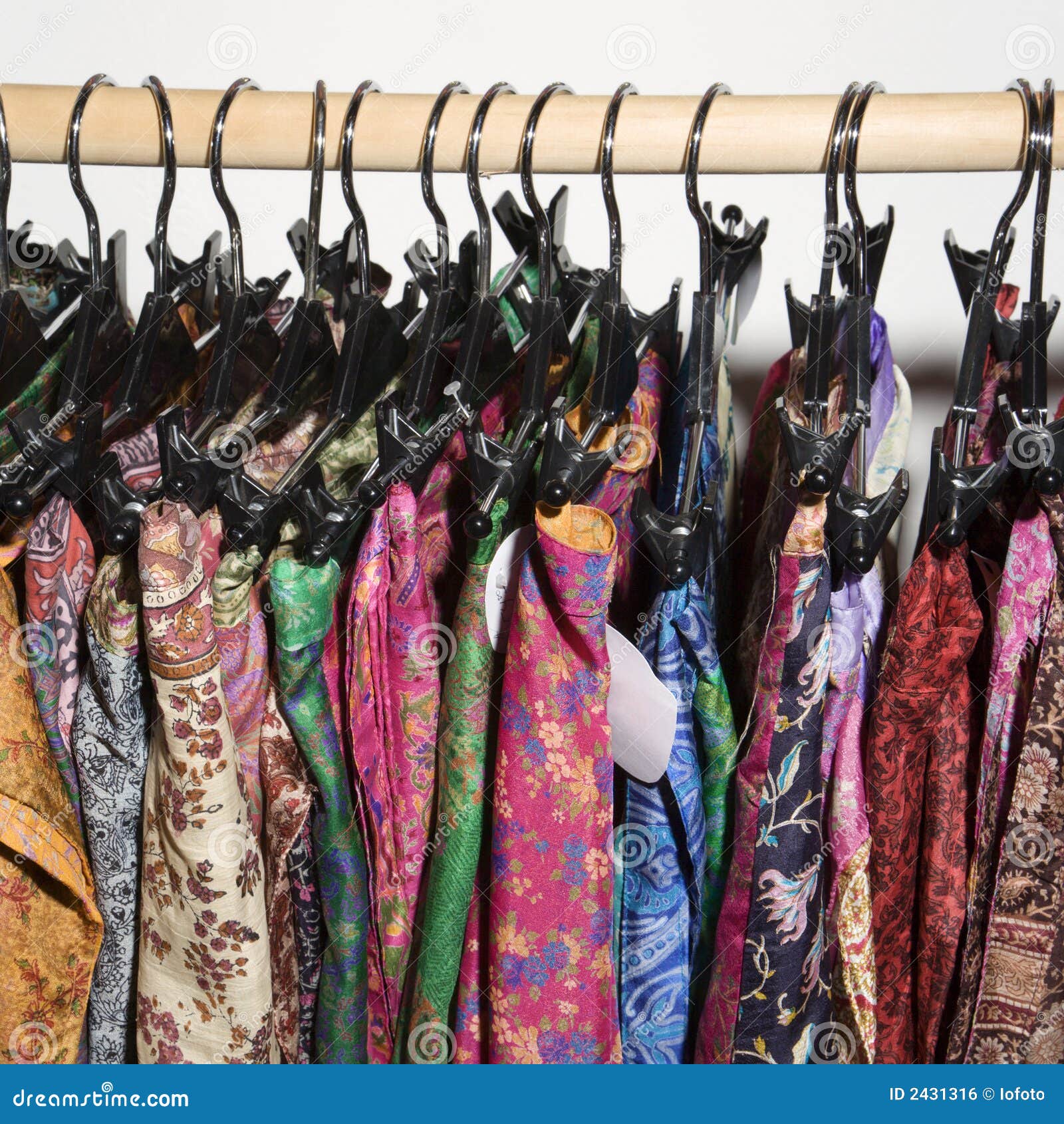 Colorful clothes on rack. stock photo. Image of bright - 2431316