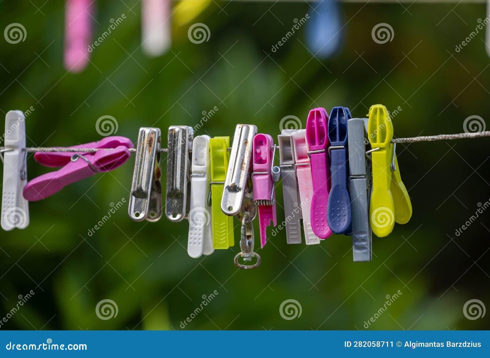 Colorful Clothespins on a Rope on a Blurred Background Stock Image ...