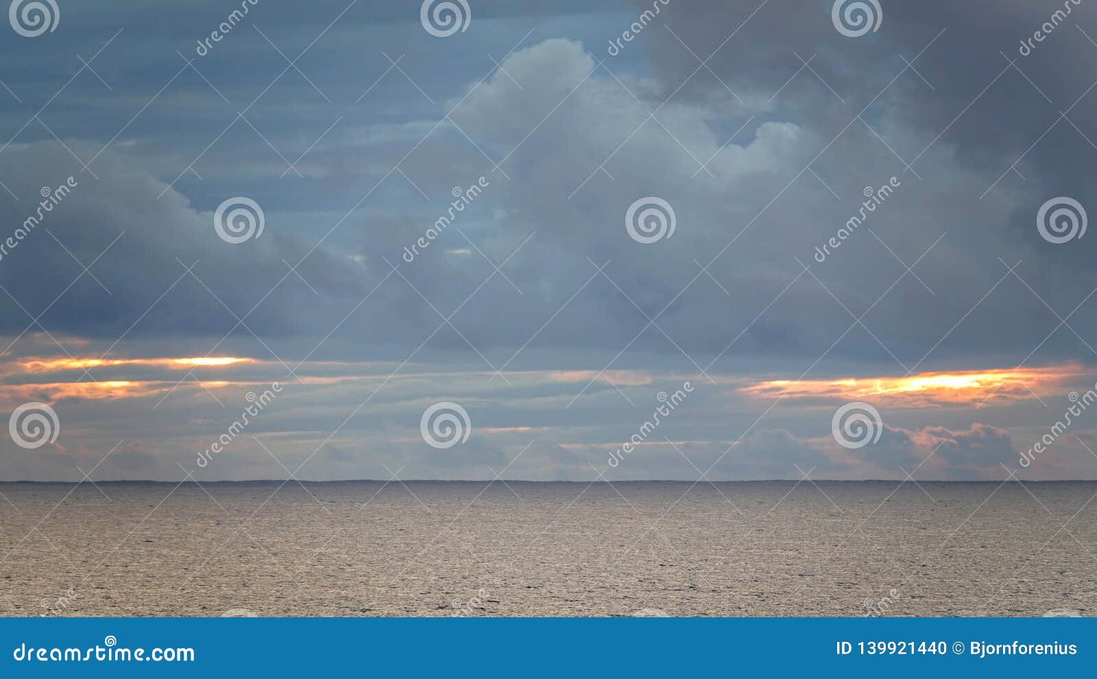 Colorful Clouds Over Calm Ocean at Sunset Stock Photo - Image of black ...