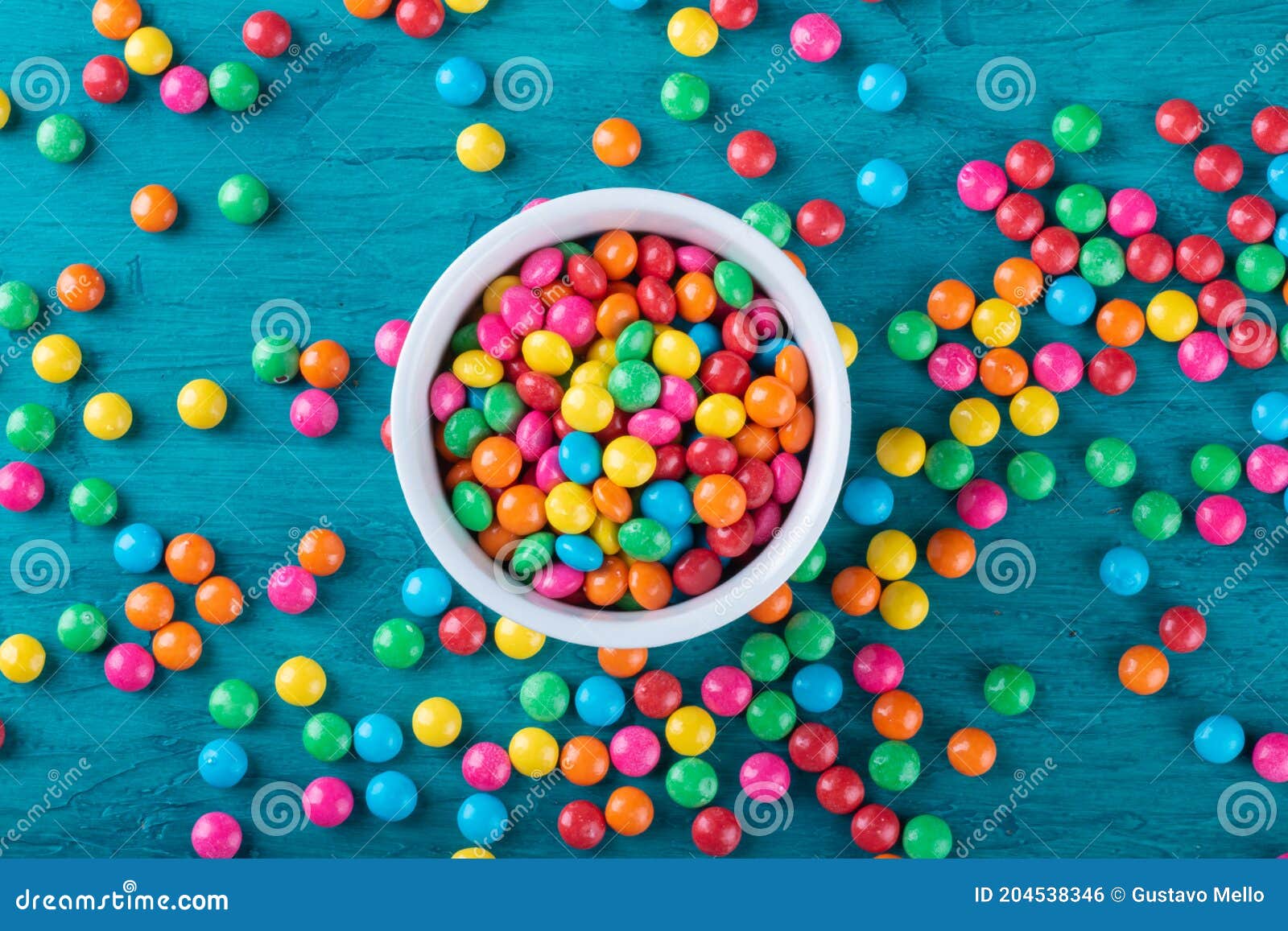 Colorful Confetti Candy in Bowl with Blue Background Stock Photo ...