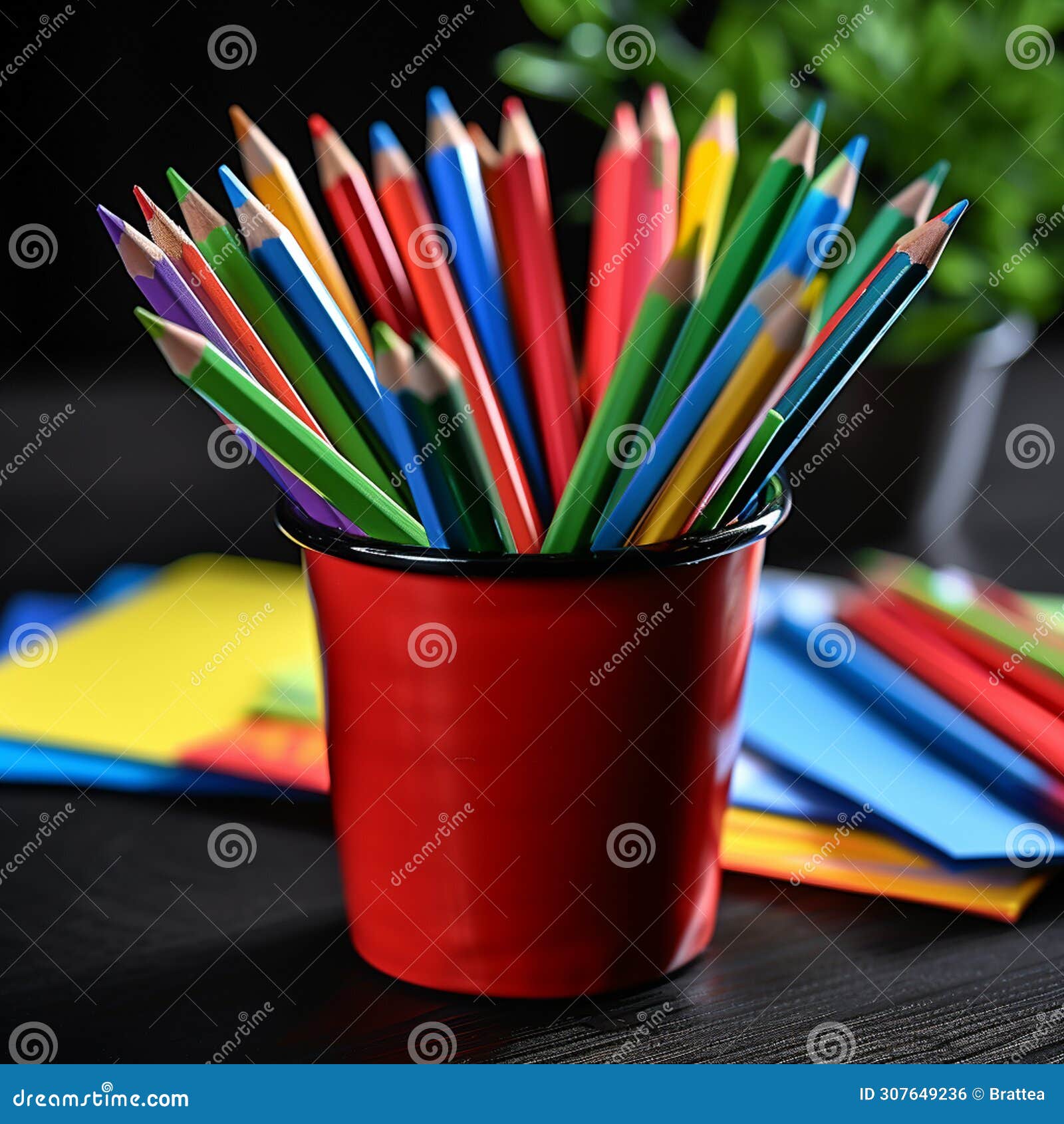 Colorful Crayons in Ceramic Mug and Stack of Drawing Papers on Wooden ...