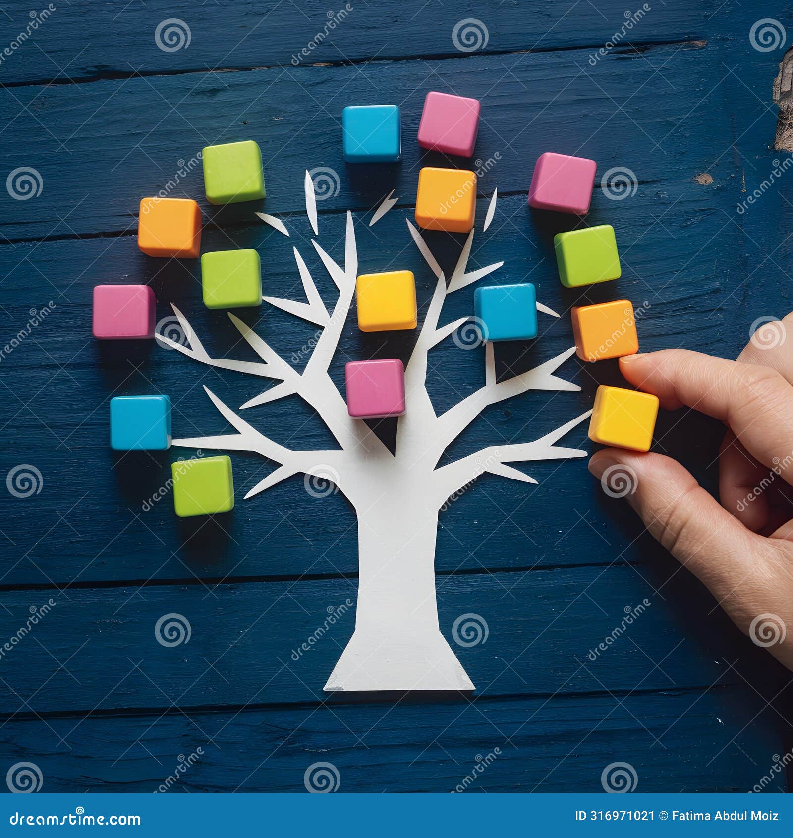 Colorful Cube Tree Structure with Hand Holding a Cube, Symbolizing ...