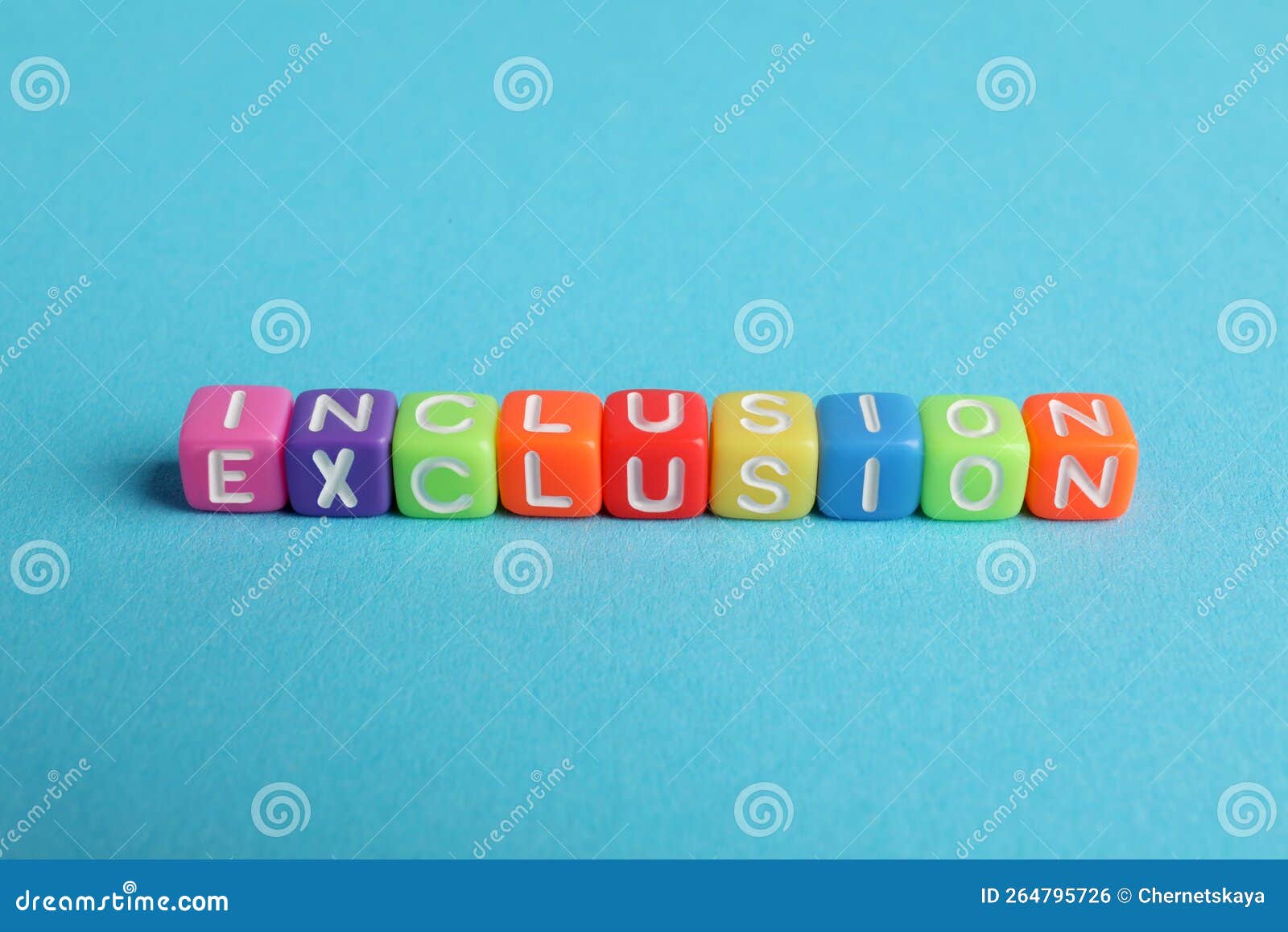 Colorful Cubes with Word Inclusion on Light Blue Background, Above View ...