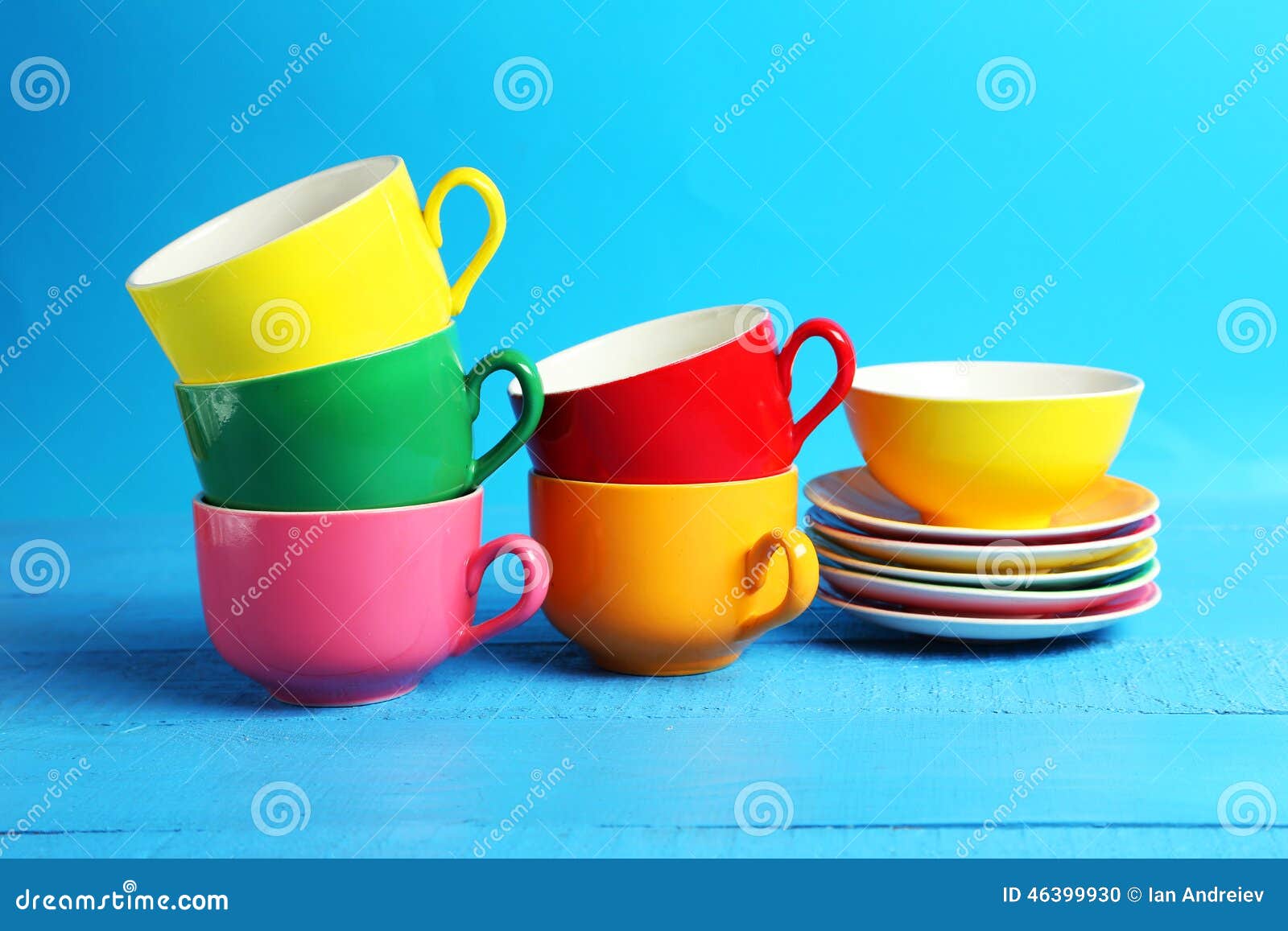 Colorful Cups on Blue Wooden Background. Stock Photo - Image of objects ...