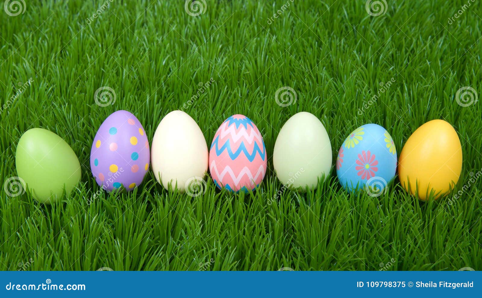 Colorful Easter Eggs in a Row on Green Grass Stock Image - Image of ...