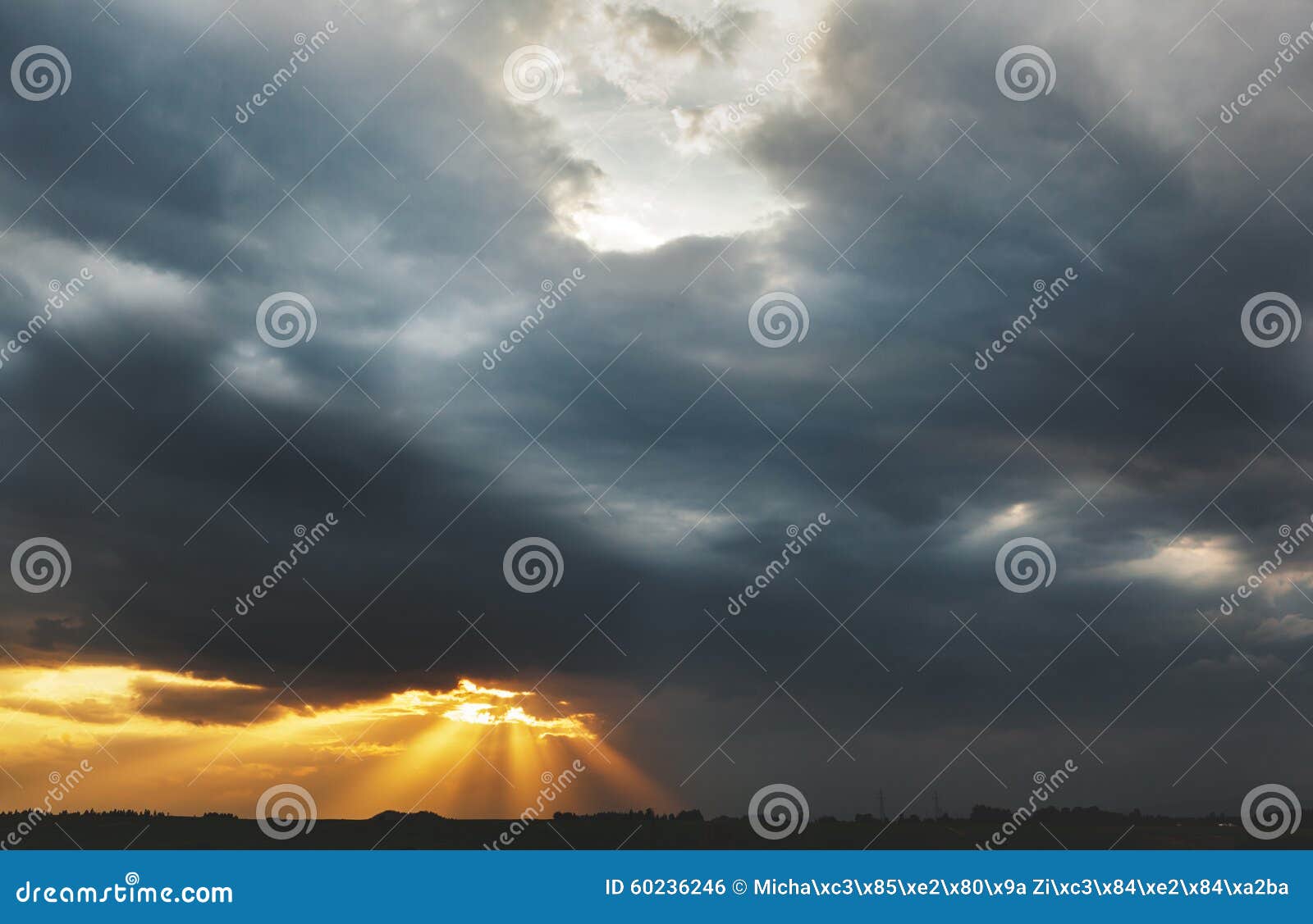 Colorful Dramatic Sky with Sunbeams and Heavy Clouds at Sunset Stock ...