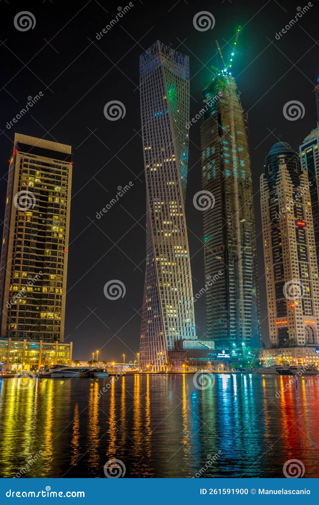 Dubai Skyline at Night with Colorful Reflections on the Water ...