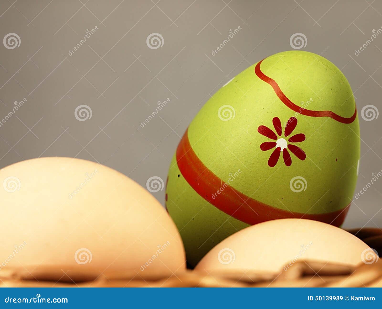 Colorful Easter Egg in the Company of Ordinary Eggs. Stock Image ...