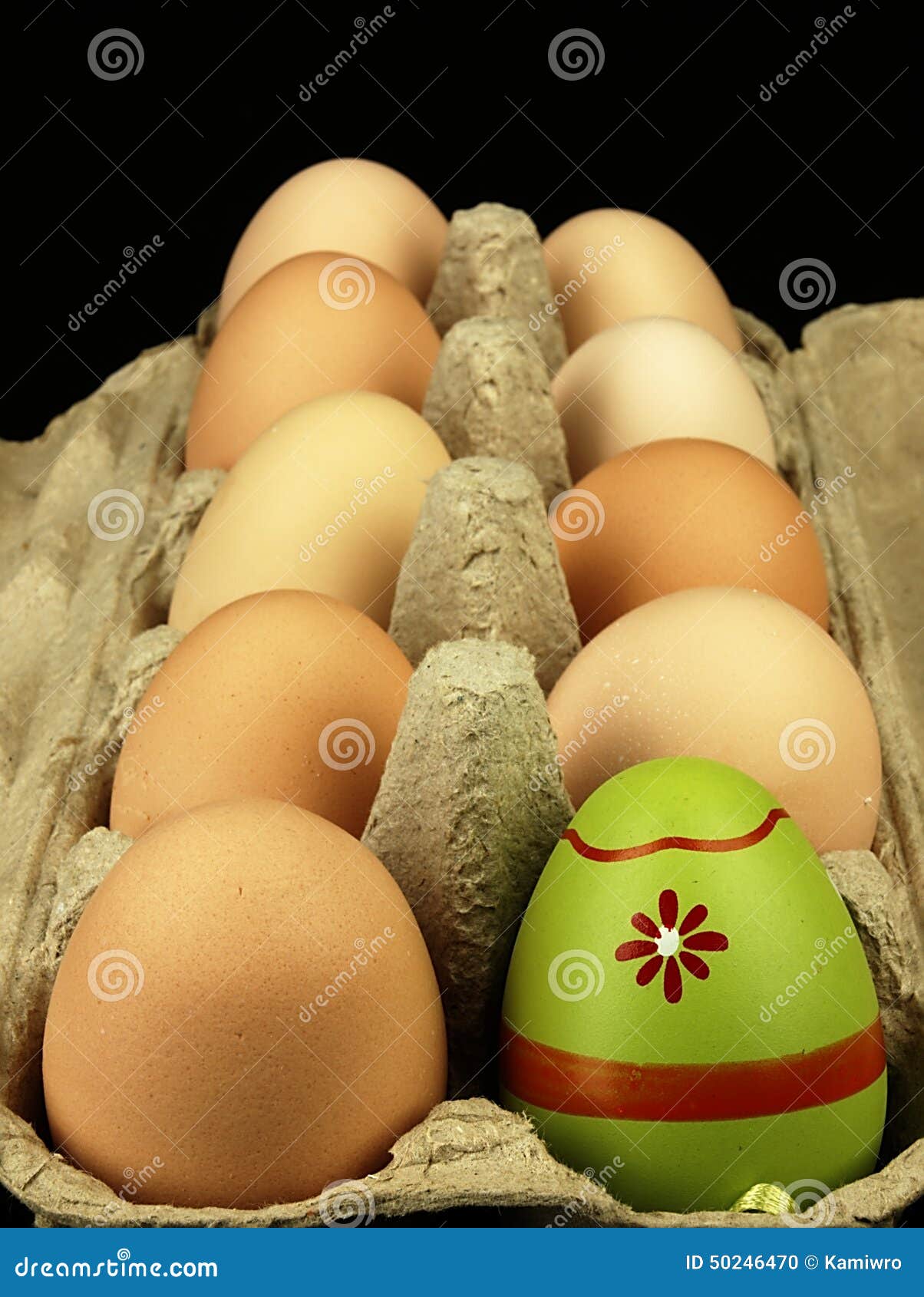 Colorful Easter Egg in the Company of Ordinary Eggs. Stock Photo ...