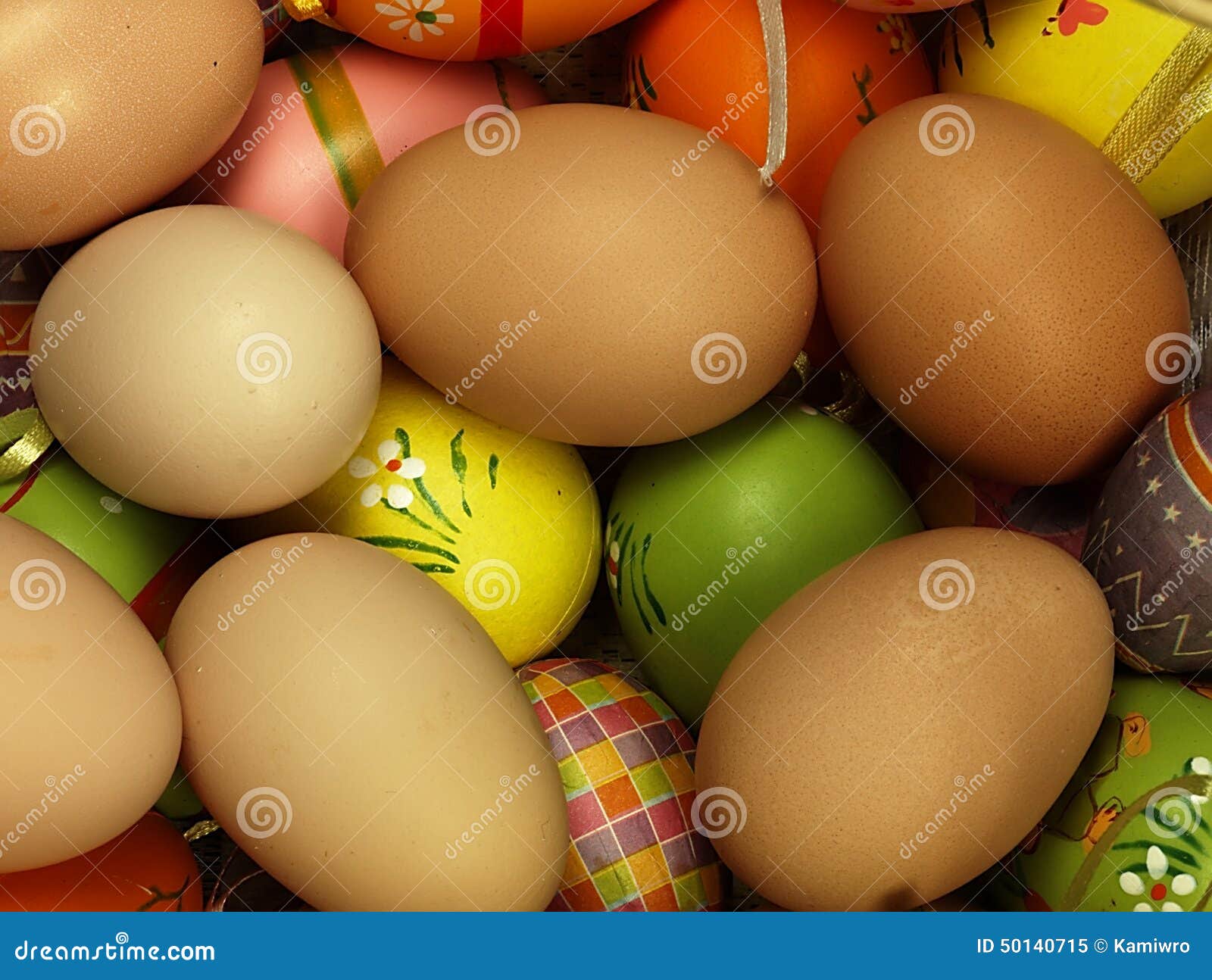 Colorful Easter Eggs in the Company of Ordinary Eggs. Stock Image ...