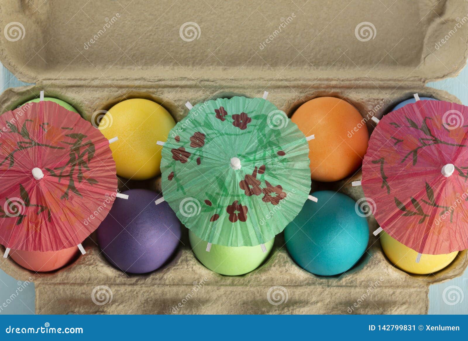 Colorful Easter Eggs Under Parasol in a Carton Stock Image - Image of ...
