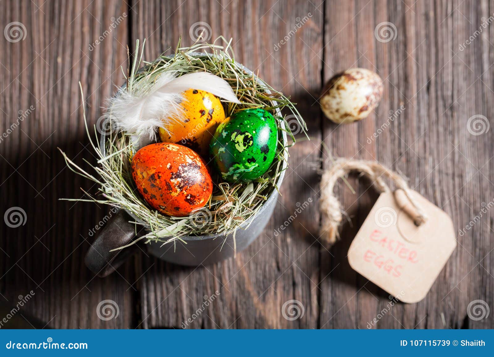 Colorful Eggs for Easter with Feathers on Wooden Table Stock Image ...