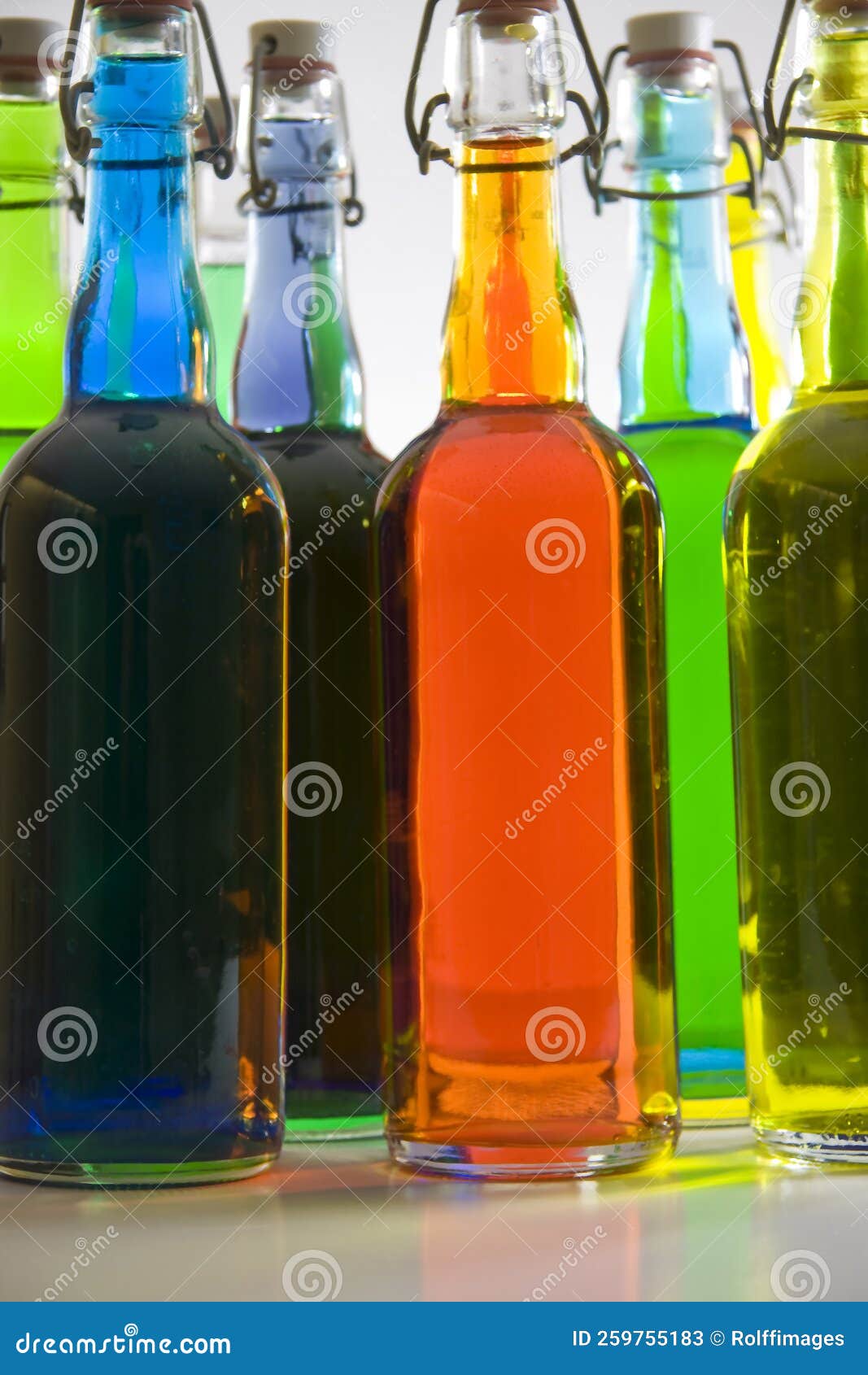 Colorful filled bottles stock image. Image of glass - 259755183