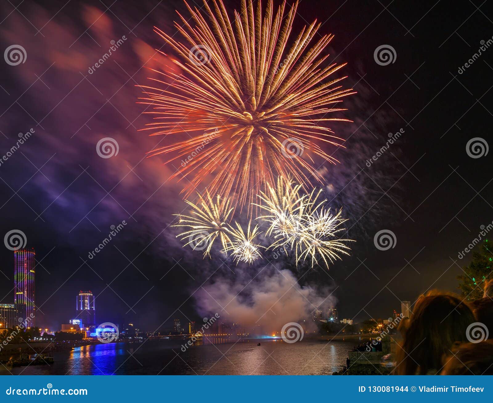 Colorful Firework Display Over City On Beach. Firework Celebration ...