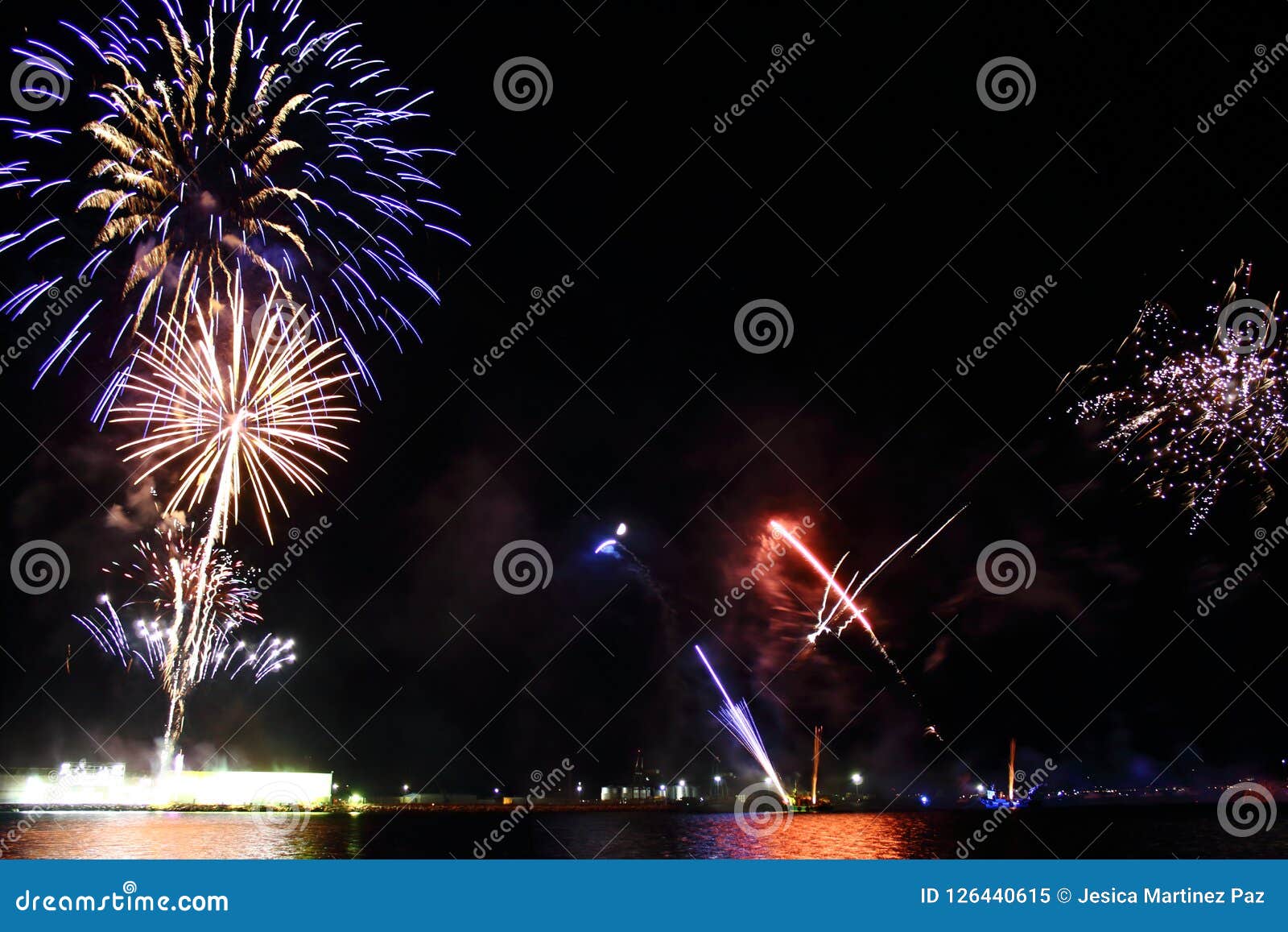 Colorful Fireworks on the Black Sky Background Over-water. Stock Image ...