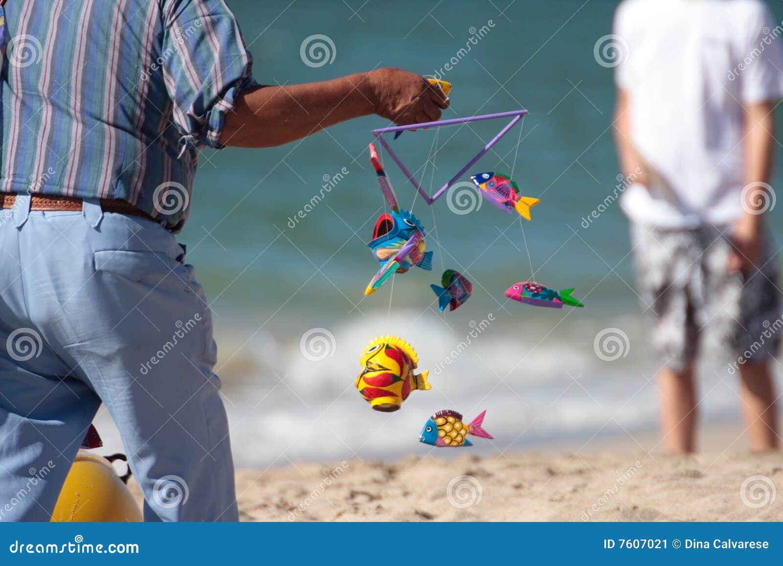Colorful Fish Mobile on Beach Stock Image - Image of people, hanging ...