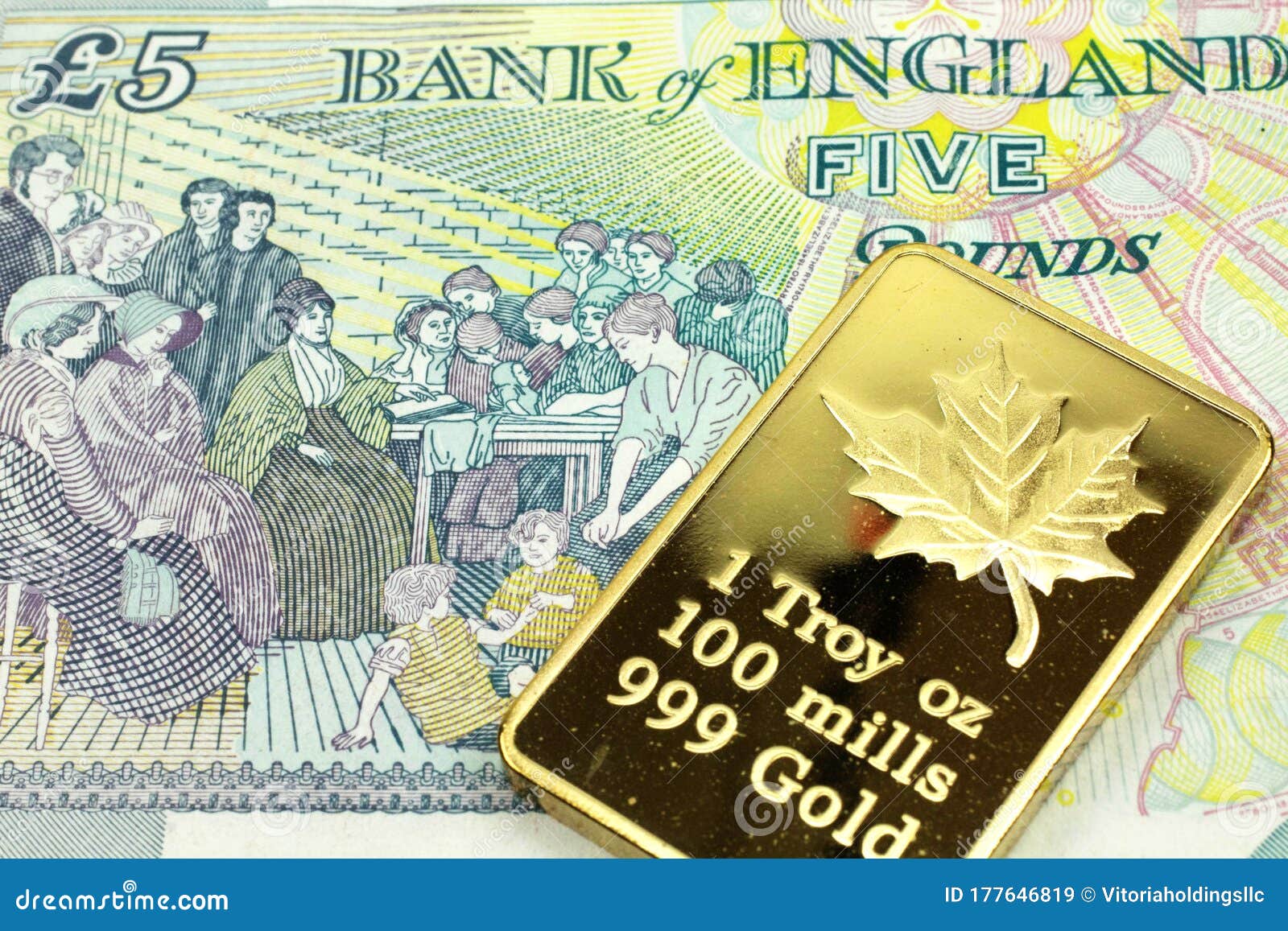A Colorful Five Pound Note from the UK with a Gold Bar in Macro ...