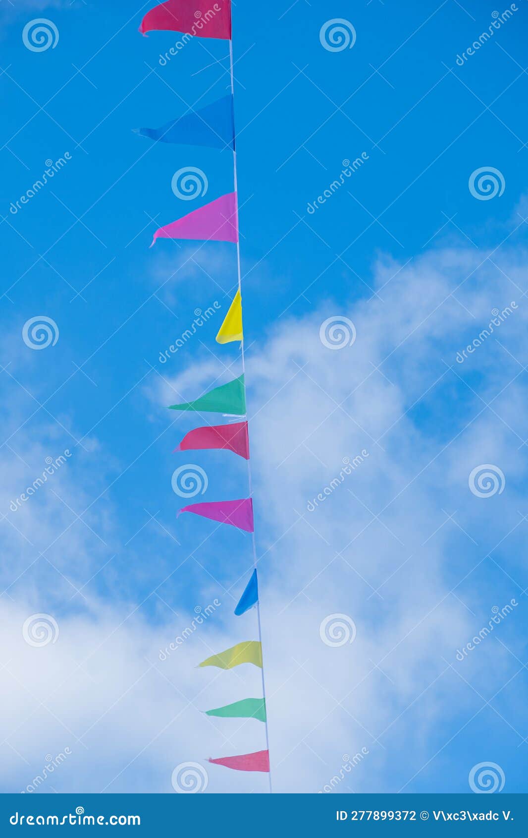Colorful Flags with Blue Sky and Clouds in the Background Stock Photo ...