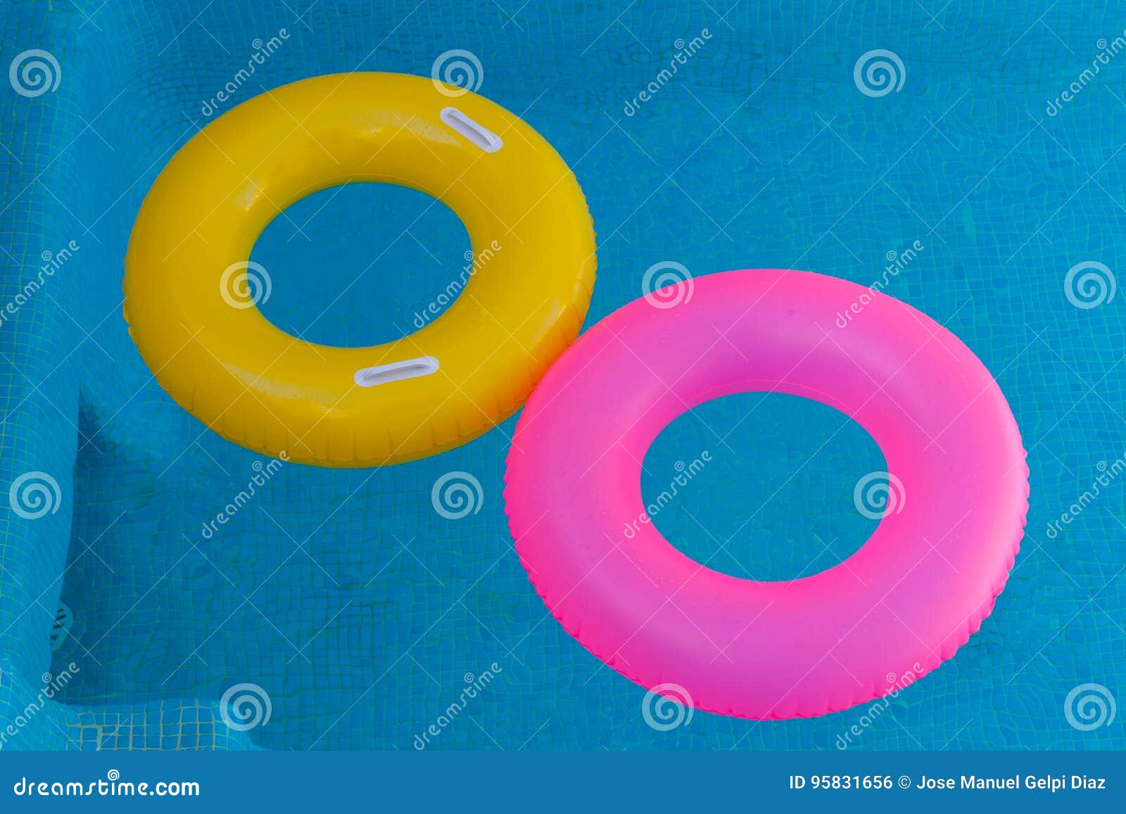Colorful Floats on a Pool with Crystal Clear Water Stock Photo - Image ...