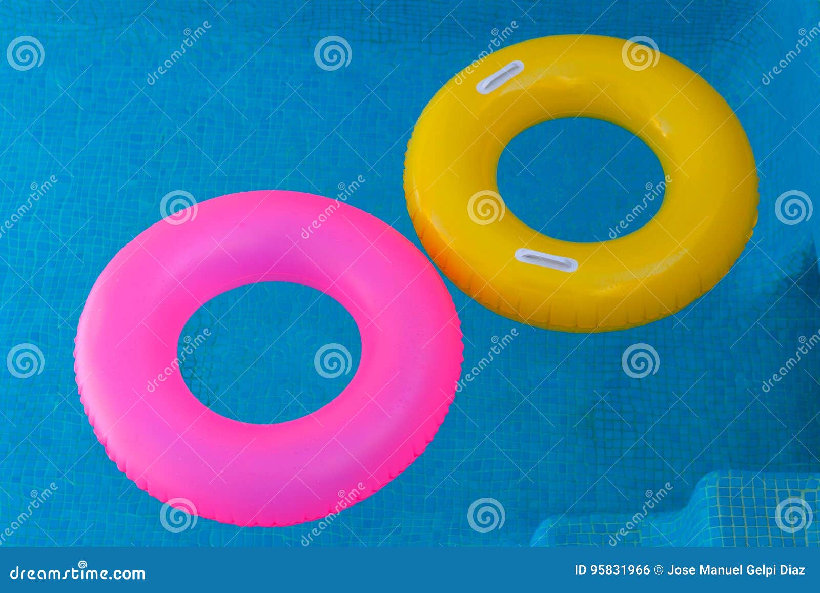 Colorful Floats on a Pool with Crystal Clear Water Stock Photo - Image ...