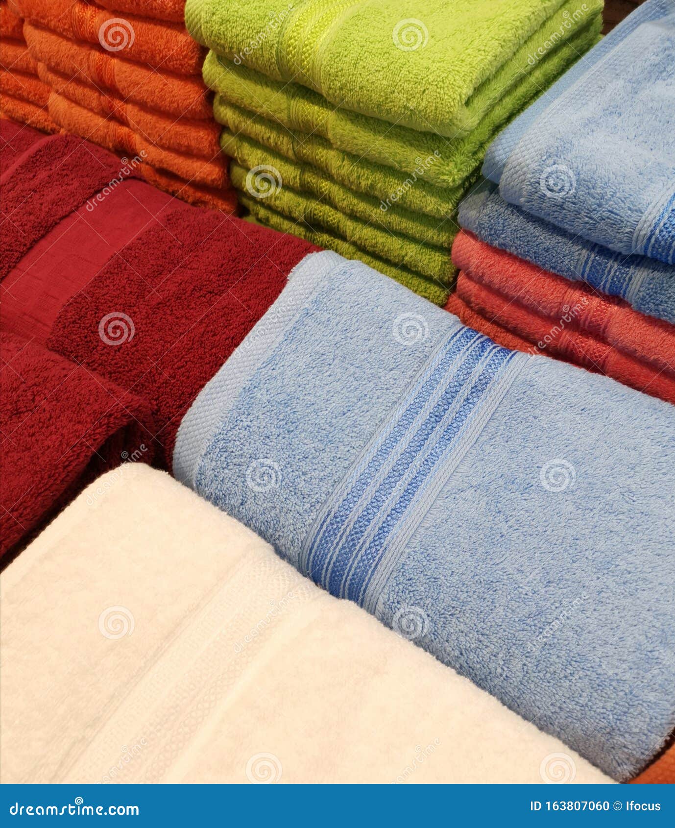 Colorful Folded Bath Towels Stock Photo - Image of folded, background ...