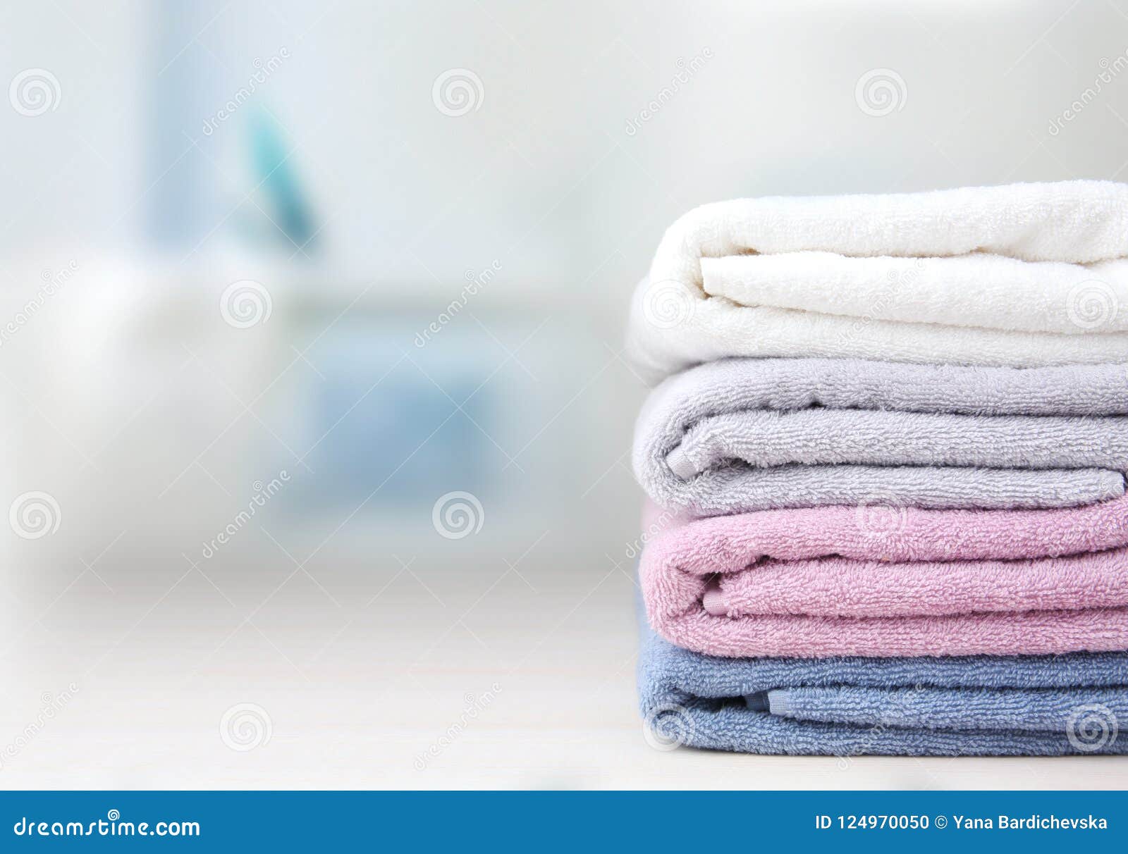 Colorful Folded Towels Stack on Table Empty Space. Stock Photo - Image ...