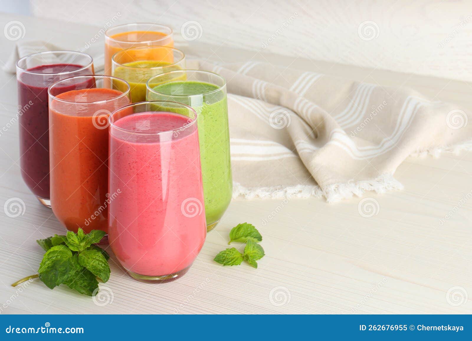 Colorful Fruit Smoothies and Fresh Mint on White Wooden Table. Space ...