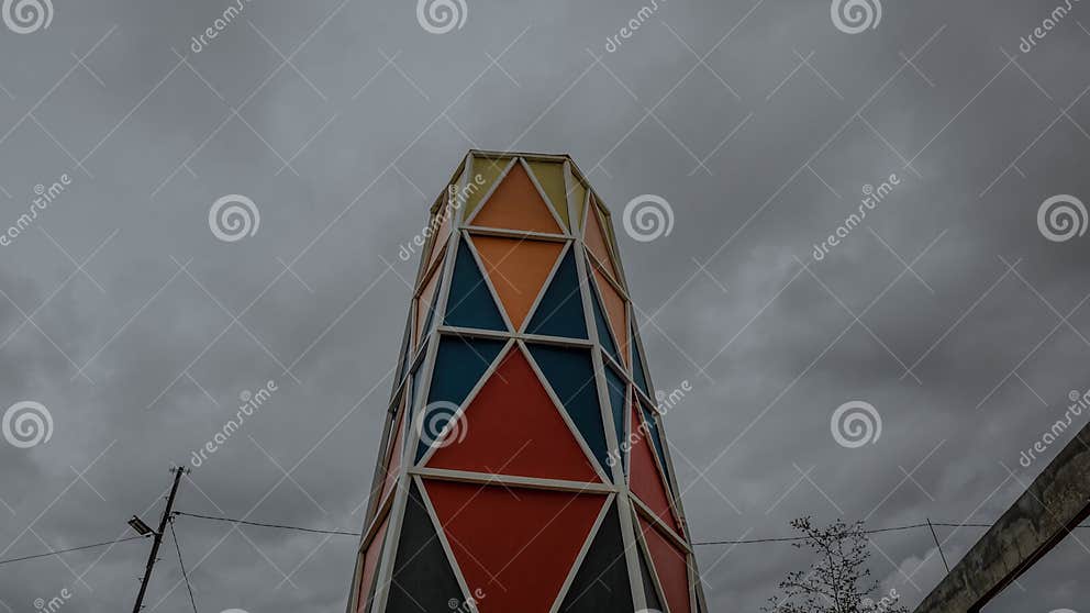 Colorful Geometric Tower Triangular Patterns with Cloudy Sky Stock ...