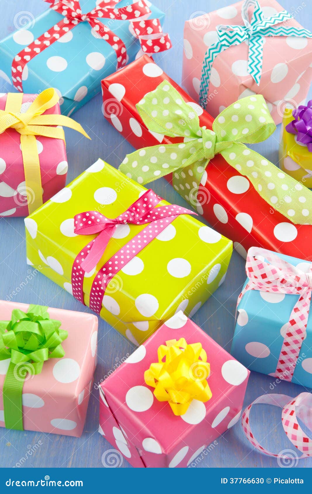 Colorful Gift Boxes Wrapped in Dotted Paper Stock Photo - Image of ...