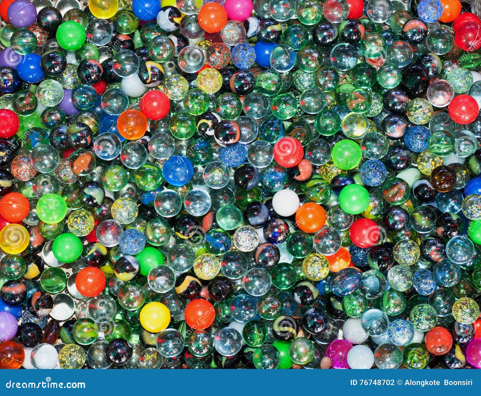 Colorful glass ball. stock photo. Image of handful, pearl - 76748702