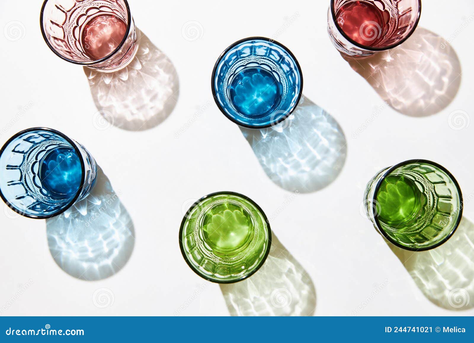 Colorful Glasses in the Sunlight with Shadows Stock Image - Image of ...