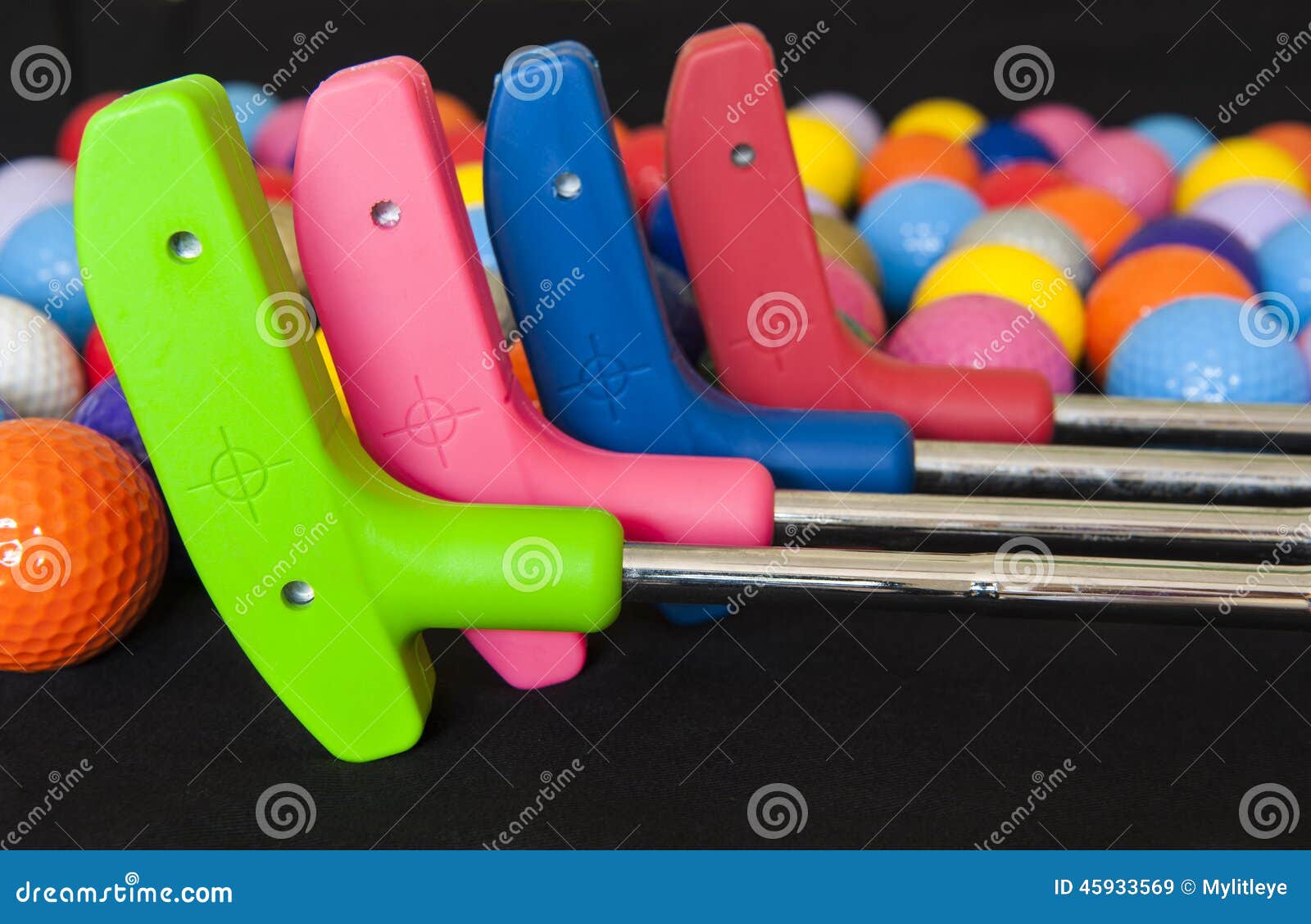 Colorful Golf Balls and Putters Stock Image - Image of game, horizontal ...